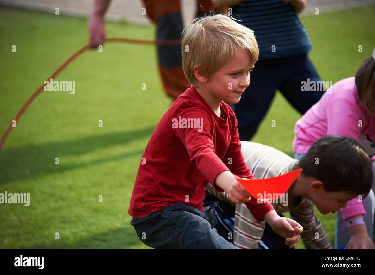Group of preschool children do sports on sports field outside Stock ...