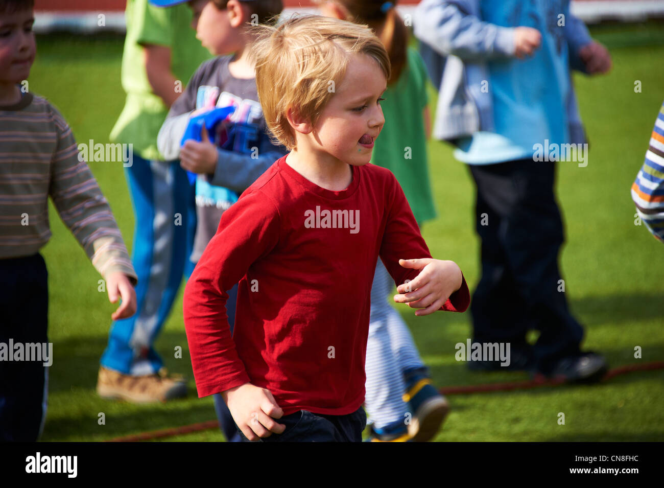 Group of preschool children do sports on sports field outside Stock ...
