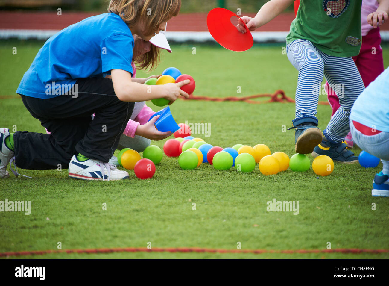 Group of preschool children do sports on sports field outside Stock ...