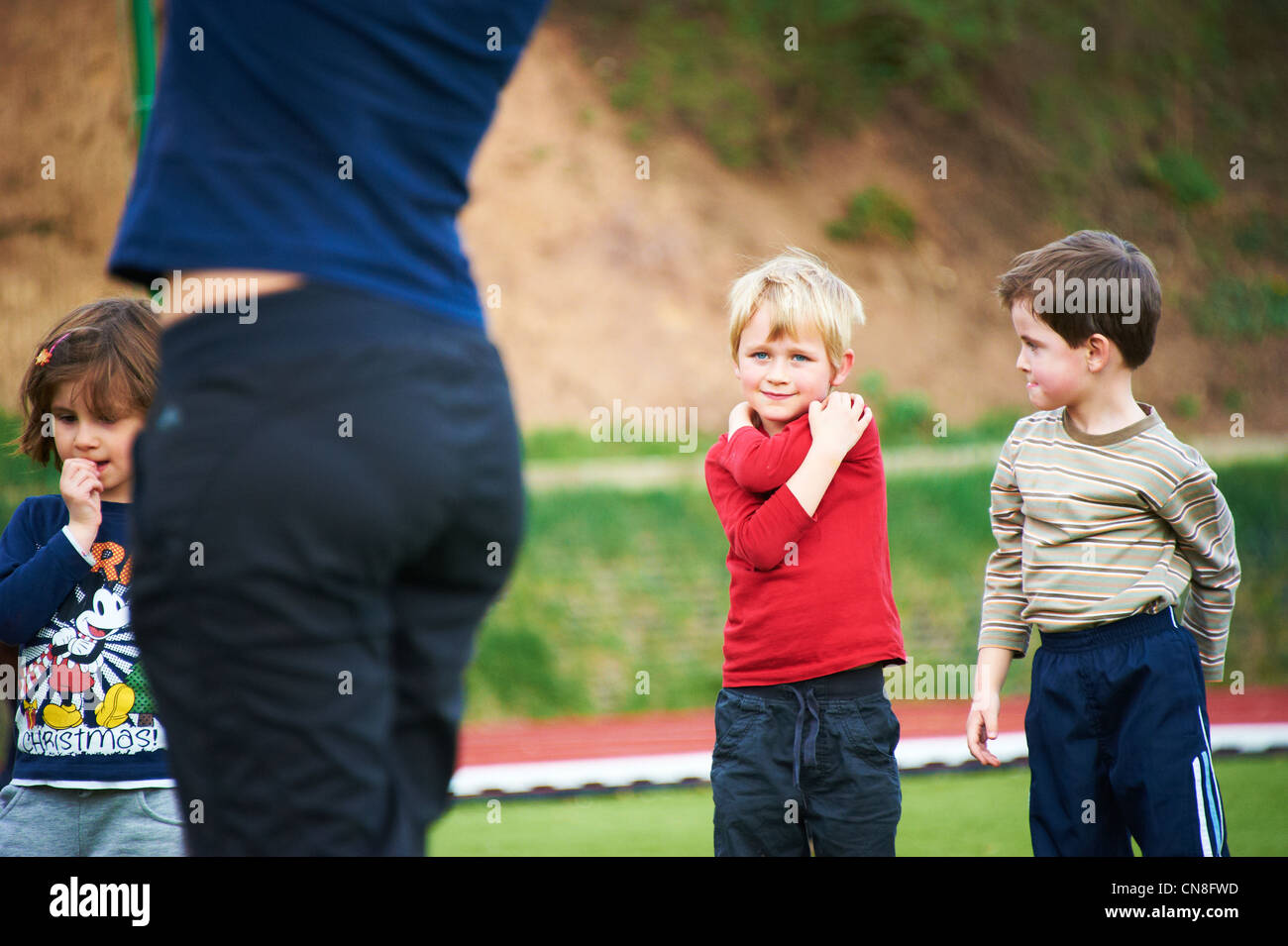 Group of preschool children do sports on sports field outside Stock ...