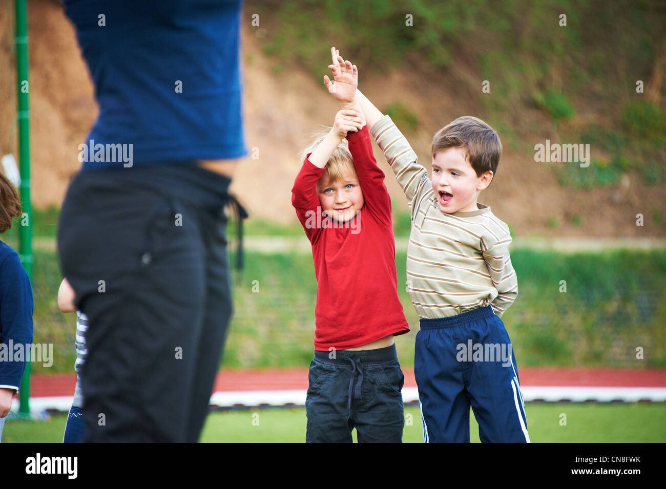 Group of preschool children do sports on sports field outside Stock ...