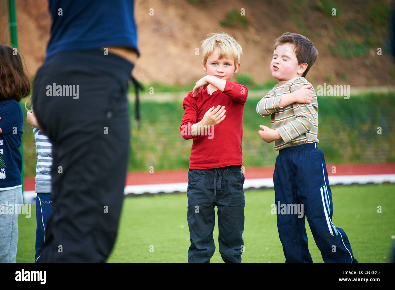 Group of preschool children do sports on sports field outside Stock ...