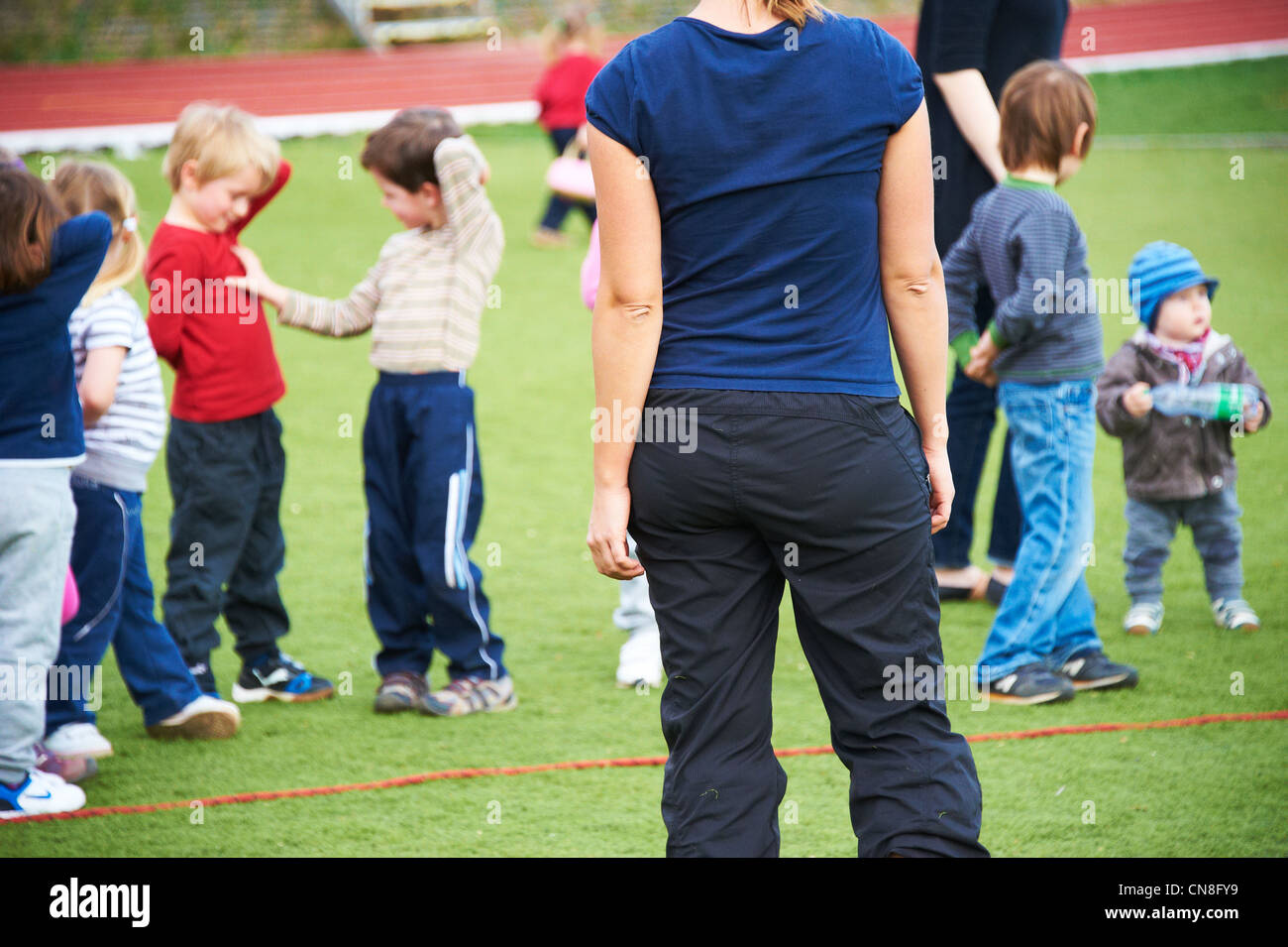 Group of preschool children do sports on sports field outside Stock ...