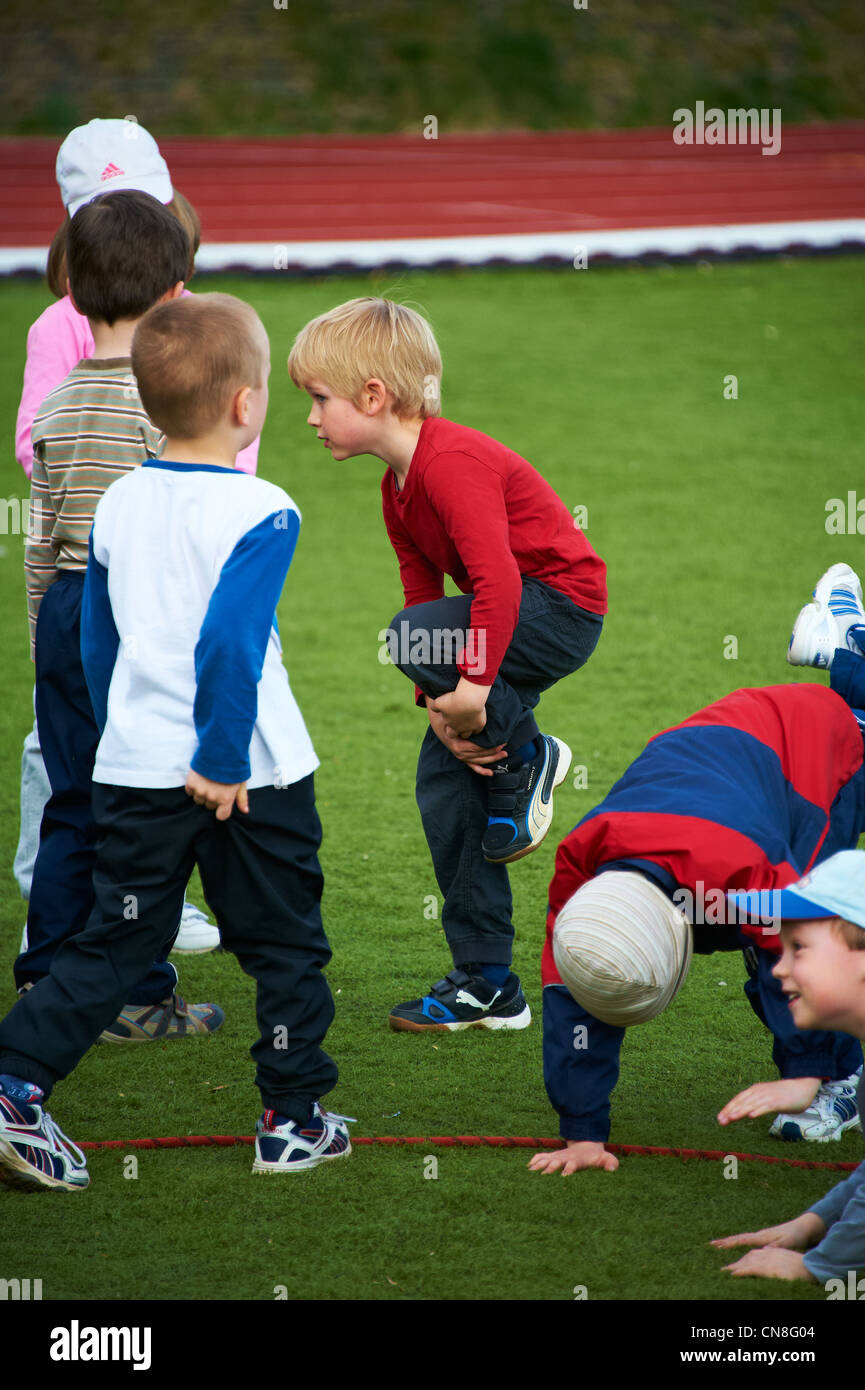 Group of preschool children do sports on sports field outside Stock ...