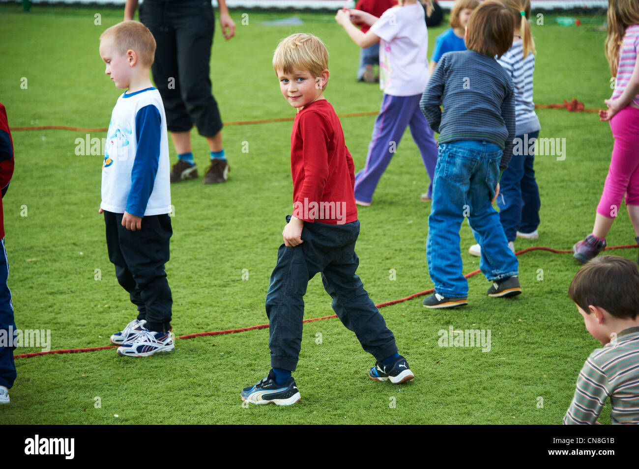 Group of preschool children do sports on sports field outside Stock ...