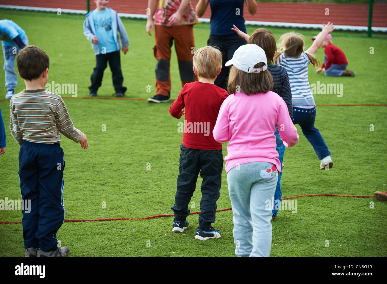 Group of preschool children do sports on sports field outside Stock ...