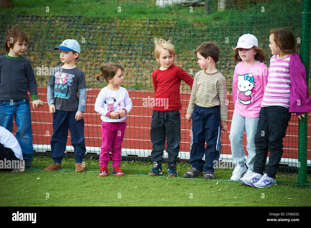 Group of preschool children do sports on sports field outside Stock ...