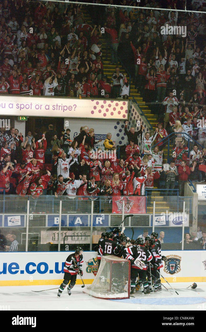 Cardiff Devils' players congratulating netminder Stevie Lyle in front ...