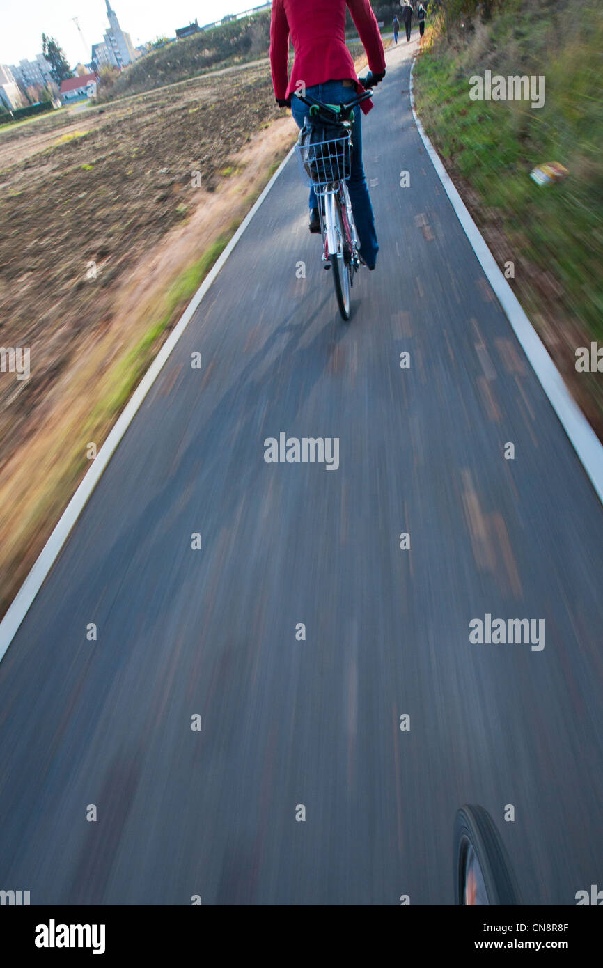 biker on a biking path in a park Stock Photo - Alamy