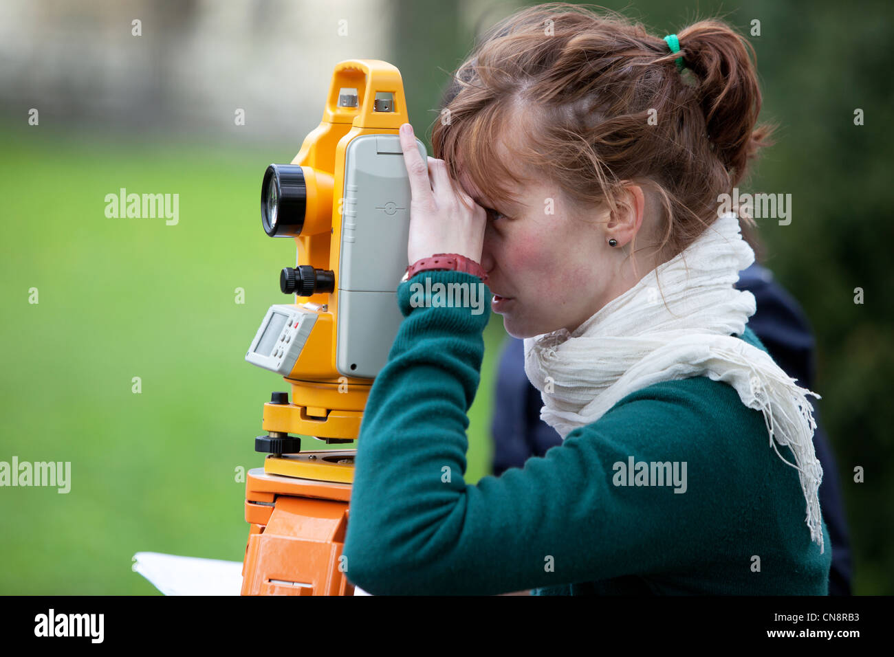 young land surveyor at work Stock Photo - Alamy