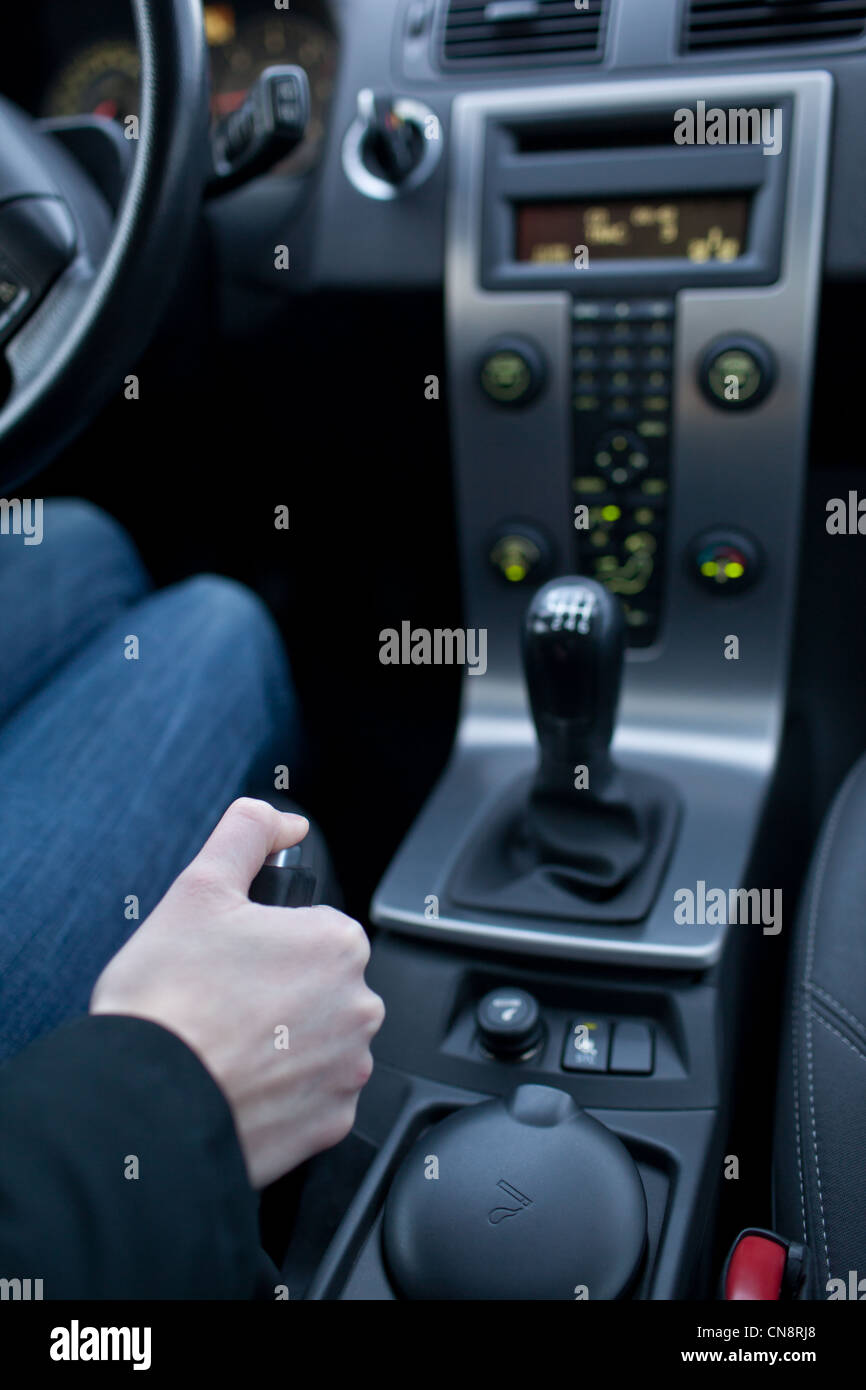 driving concept - young female driver using handbrake Stock Photo - Alamy