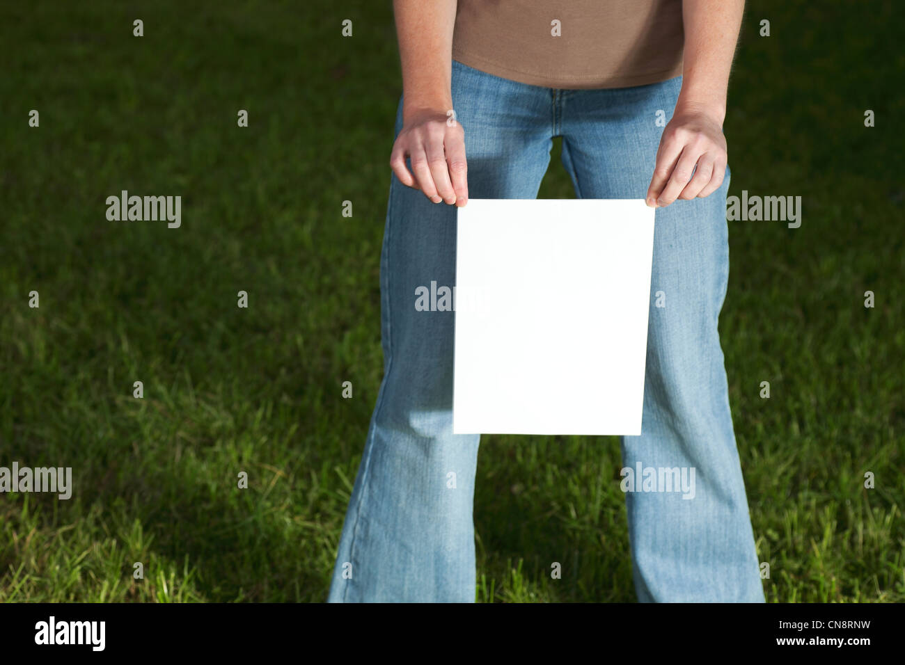 woman with blank paper outdoor Stock Photo - Alamy