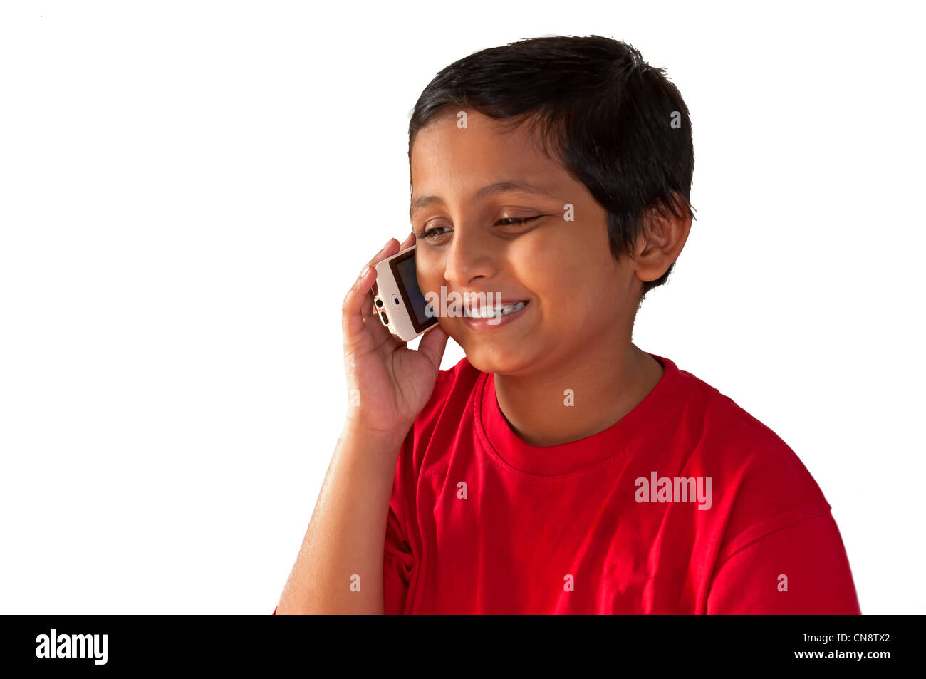 Asian, Indian, Bengali young boy talking on mobile phone, smiling ...