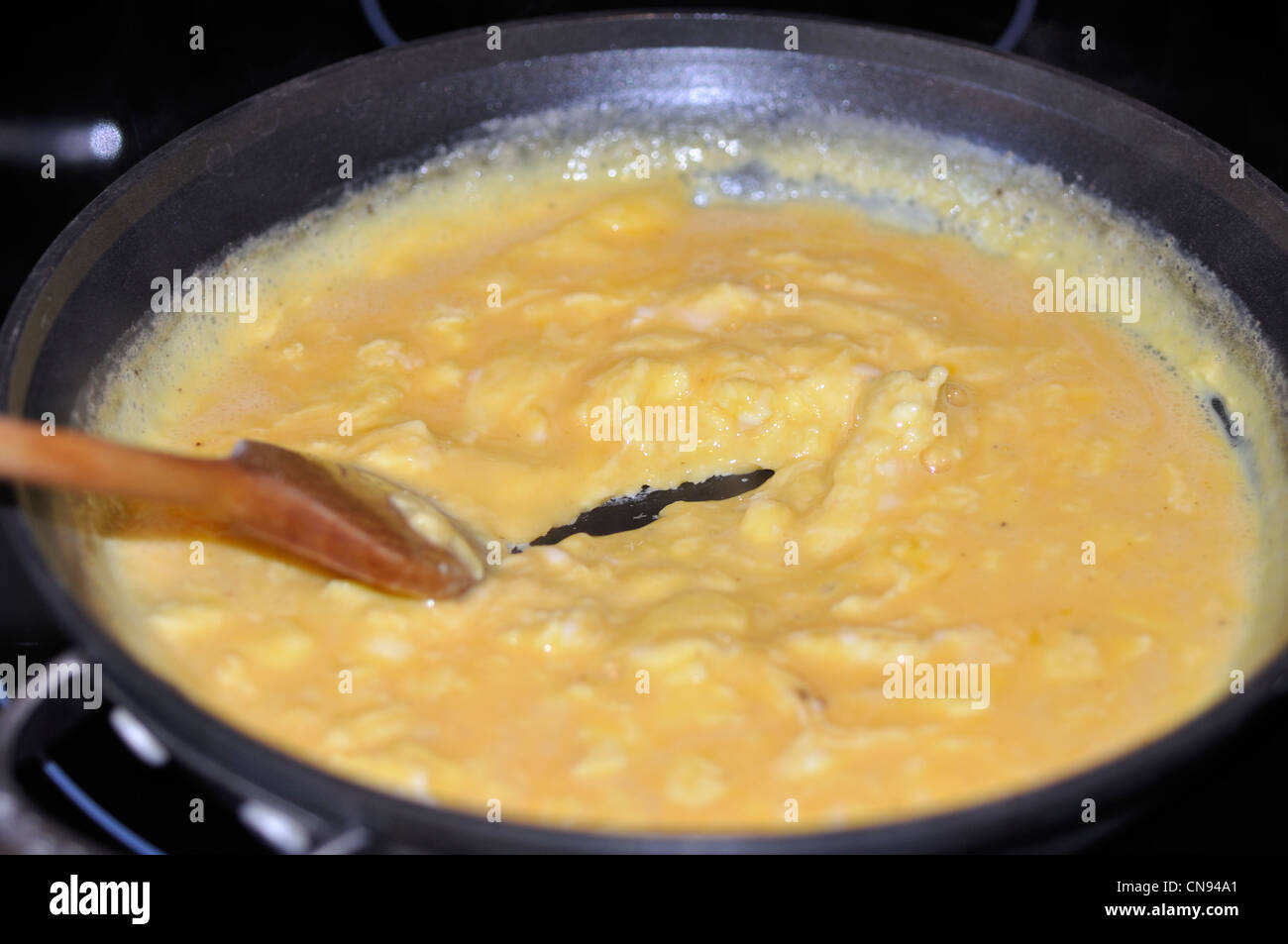 Making omelet in pan Stock Photo - Alamy