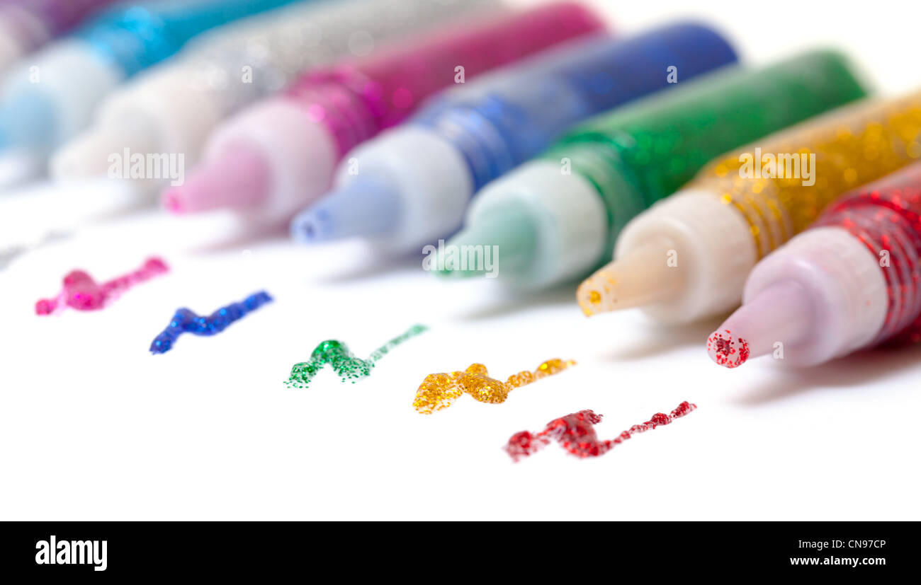 Set Colorful sparkle glue pens on white background Stock Photo - Alamy