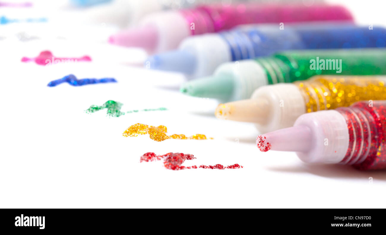 Set Colorful sparkle glue pens on white background Stock Photo - Alamy
