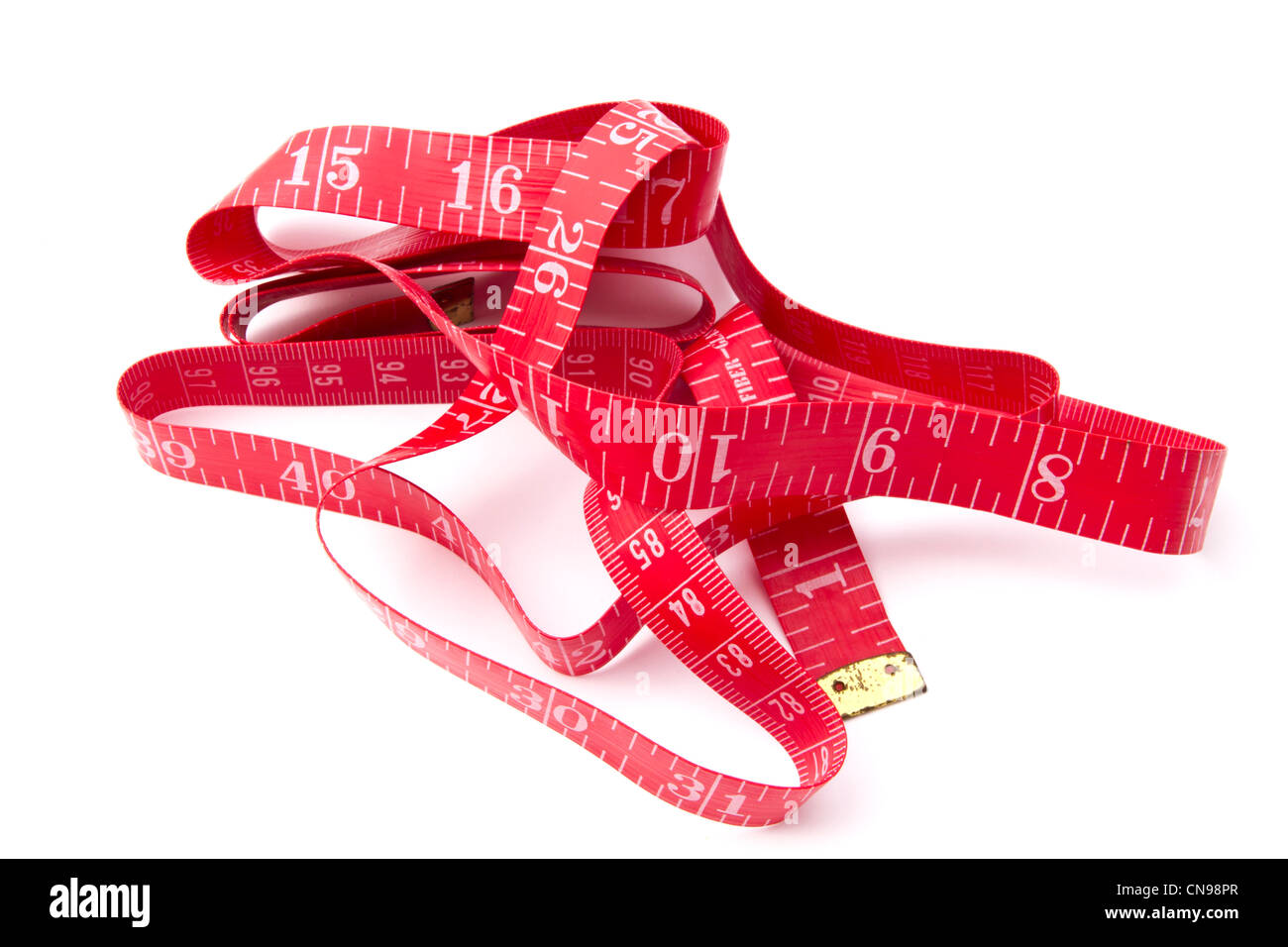Red tape measure closeup on white background Stock Photo - Alamy
