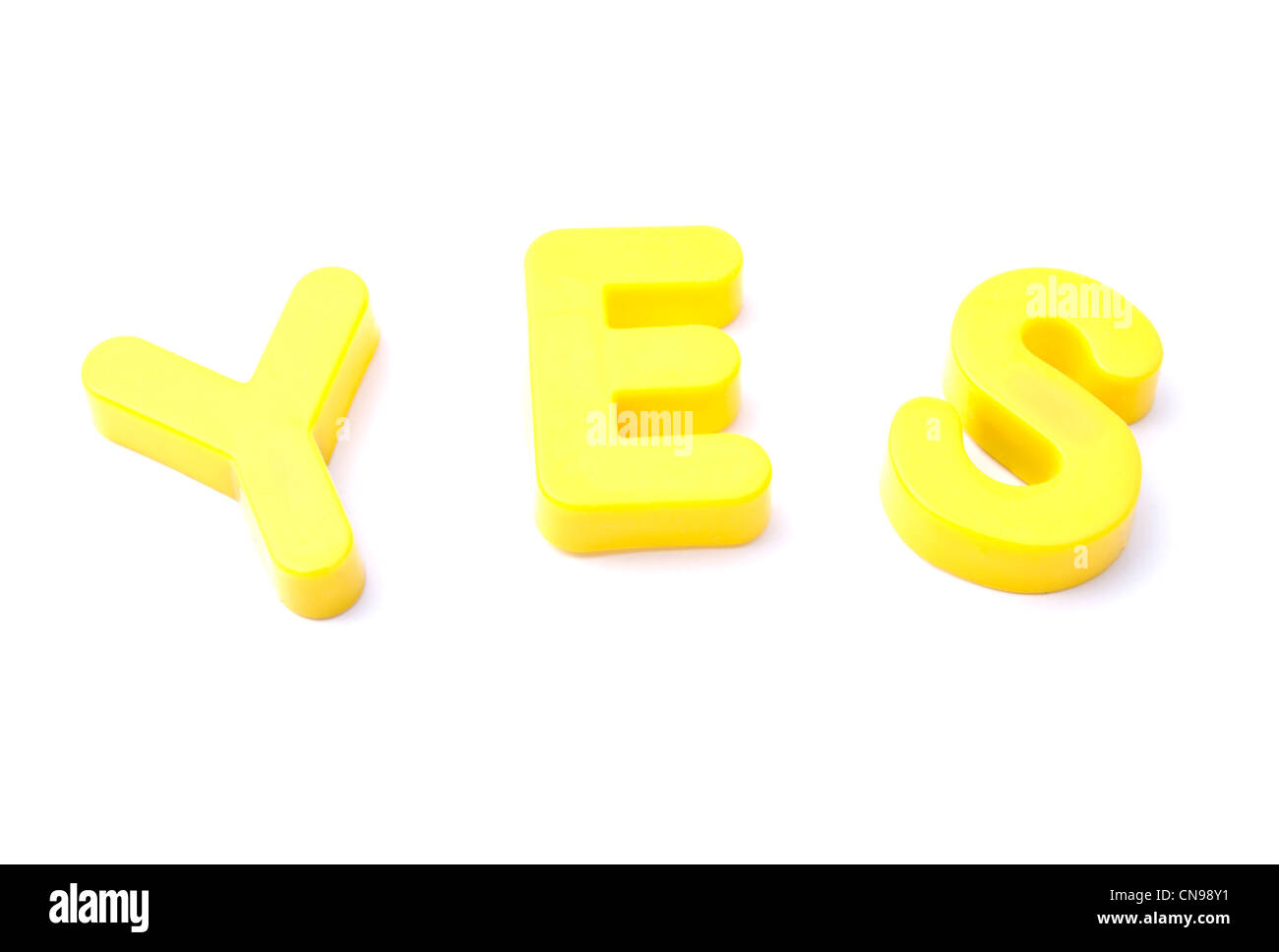 Letter magnets " yes" closeup on white background Stock Photo - Alamy