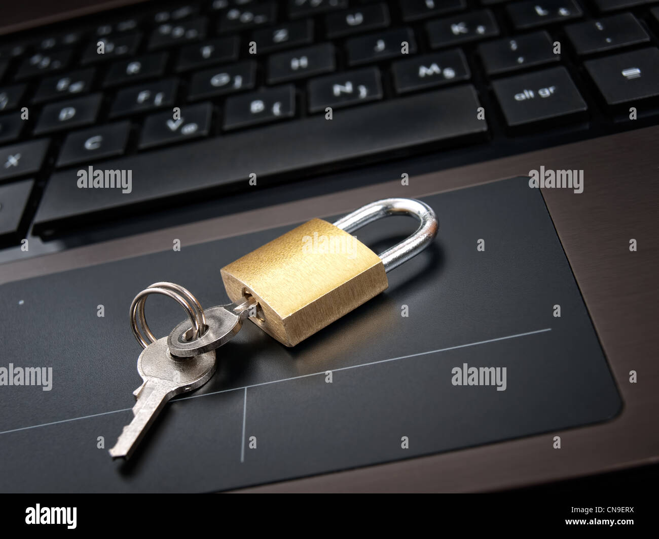 Keys and padlock on the computer touchpad as a data security concept ...