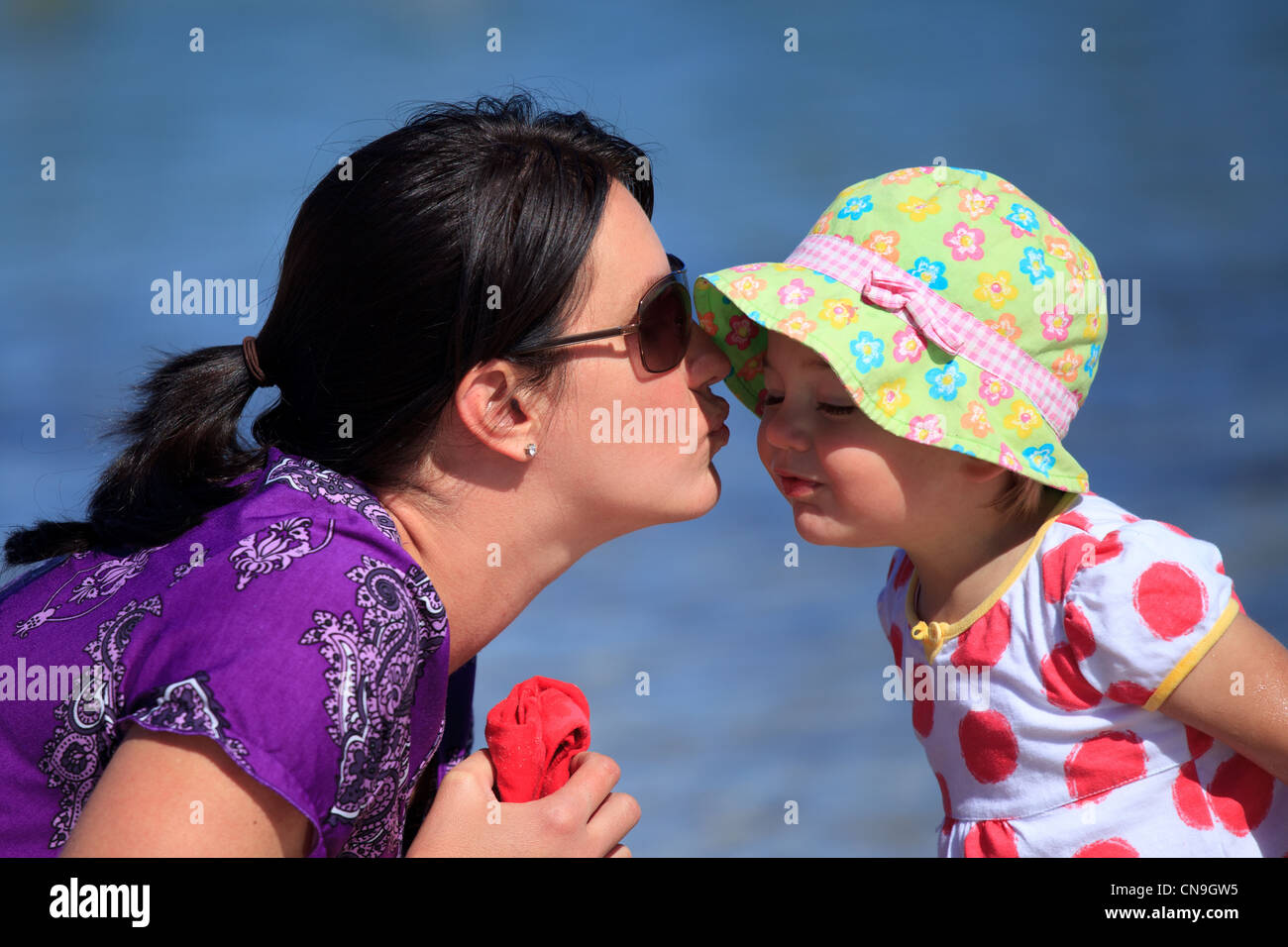 Mother kiss daughter hi-res stock photography and images - Alamy