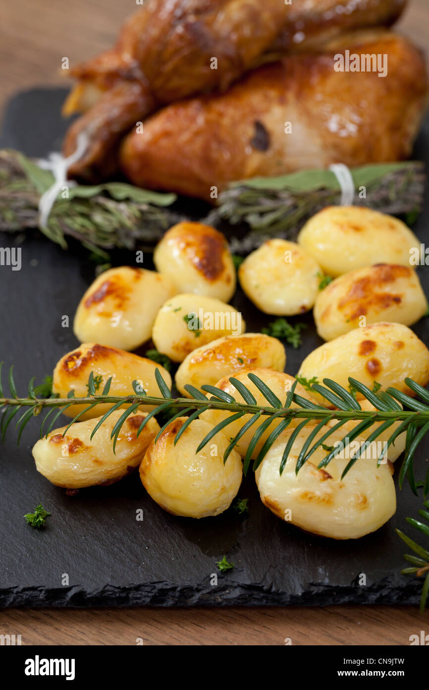 Tasty chicken with roasted potatoes Stock Photo - Alamy