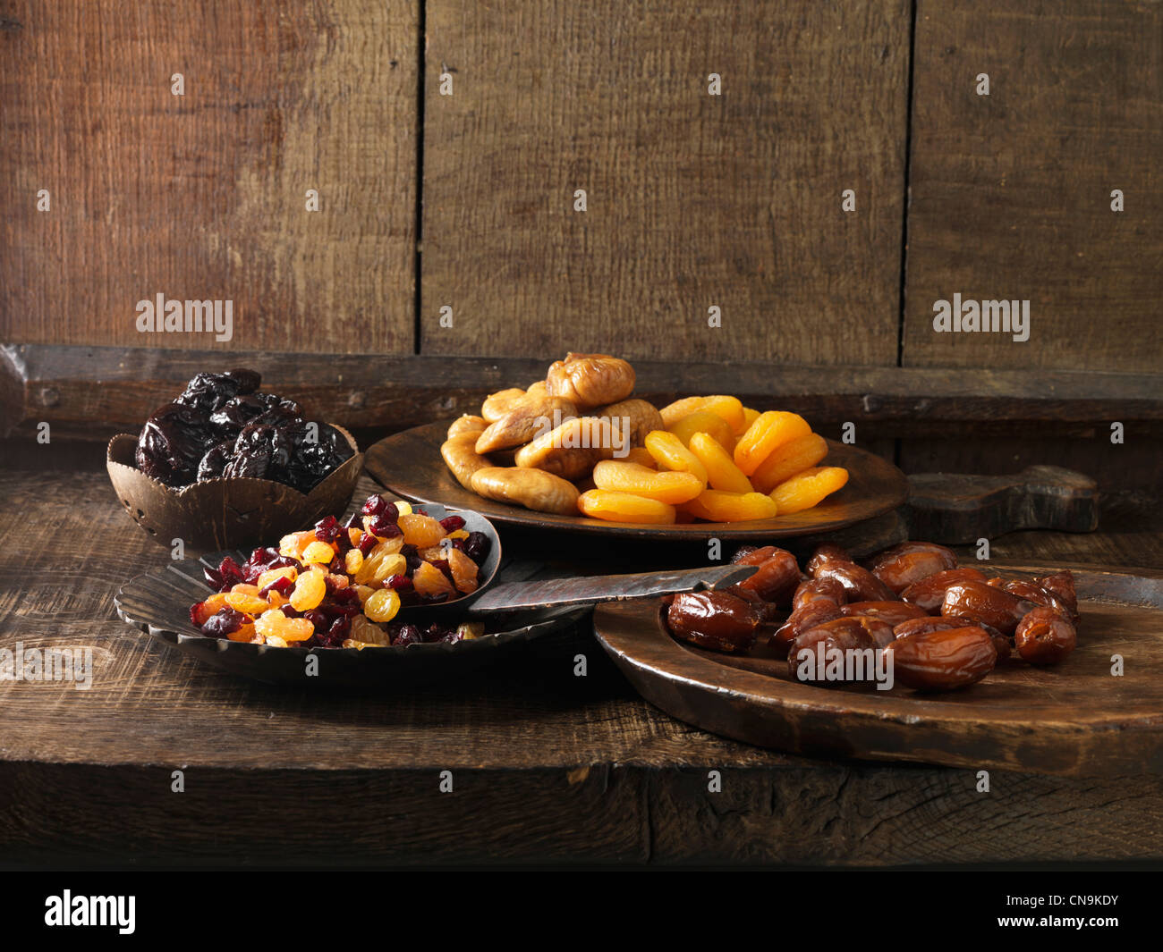 Dried fruits on assorted serving plates Stock Photo - Alamy