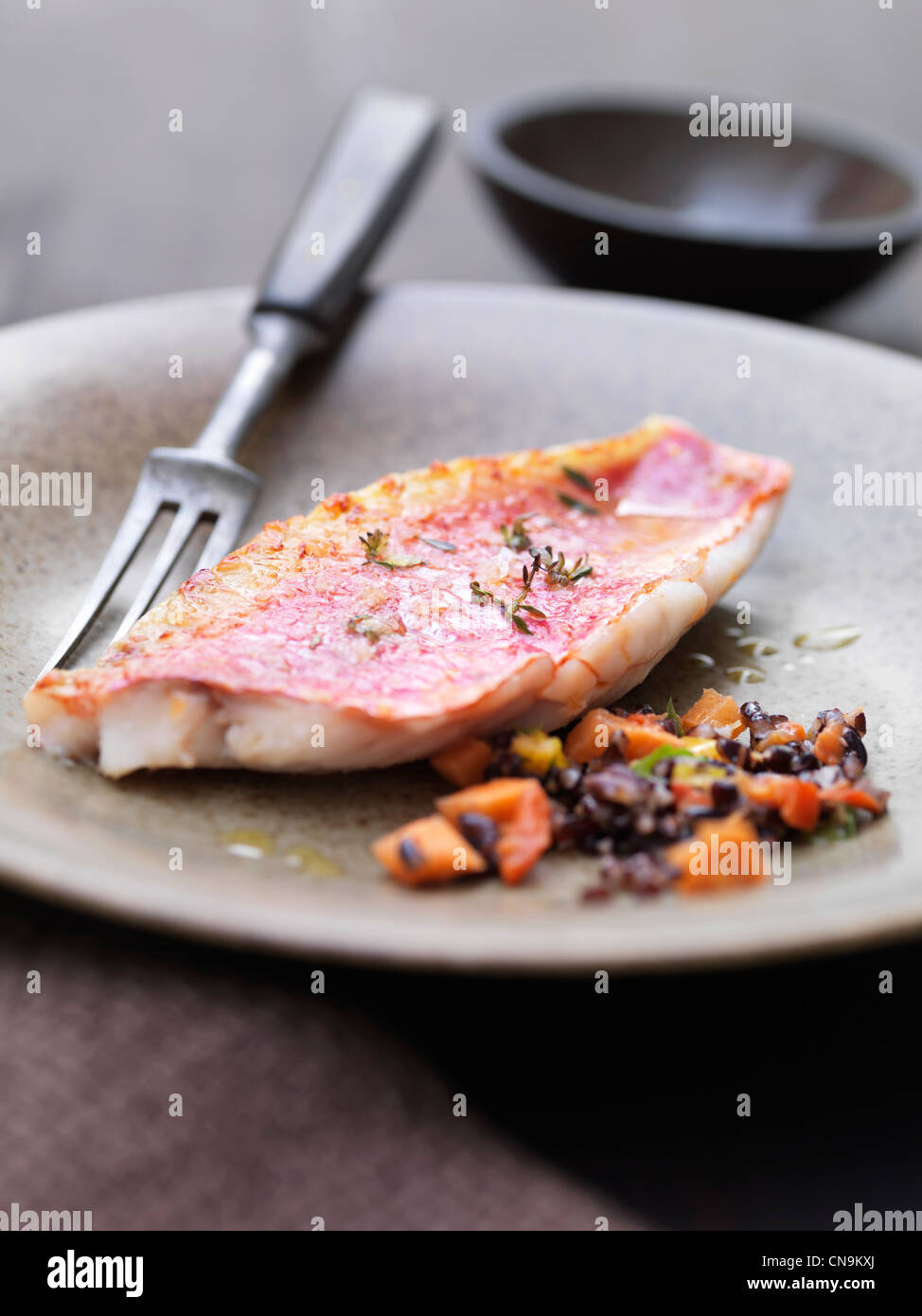 Close up of red mullet with wild rice Stock Photo - Alamy