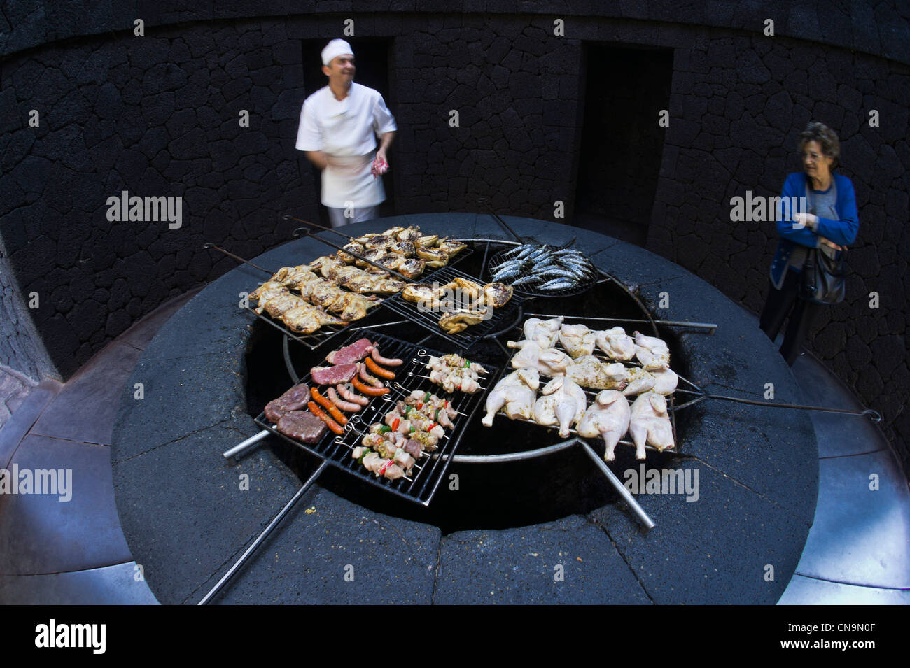 Timanfaya volcanoes national park and Visitor Centre zone. Cooking on a ...