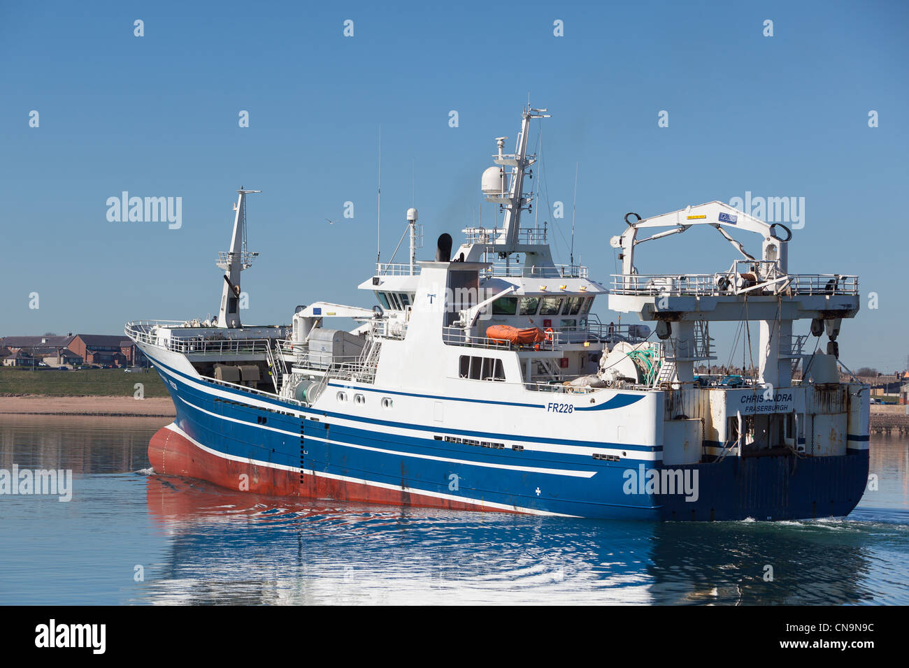 Deep sea trawlers sailing from the port of Peterhead.N.E.Scotland UK ...
