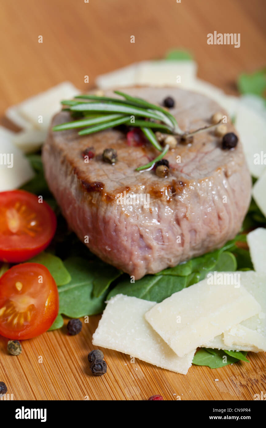 Delicious beef chop on arugula salad Stock Photo - Alamy