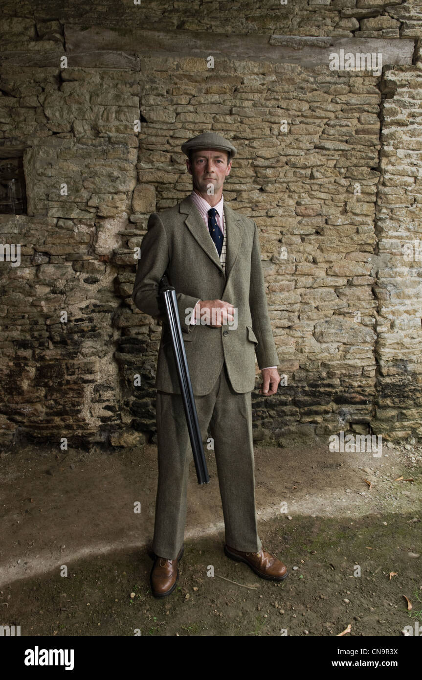 Older man carrying rifle over his arm Stock Photo - Alamy
