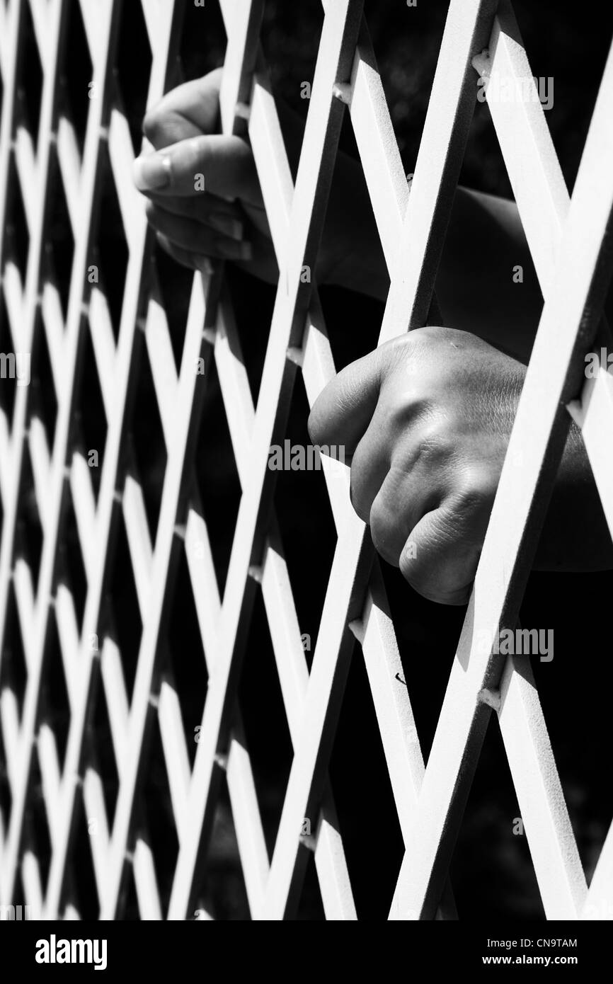 Hands holding bars Black and White Stock Photos & Images - Alamy