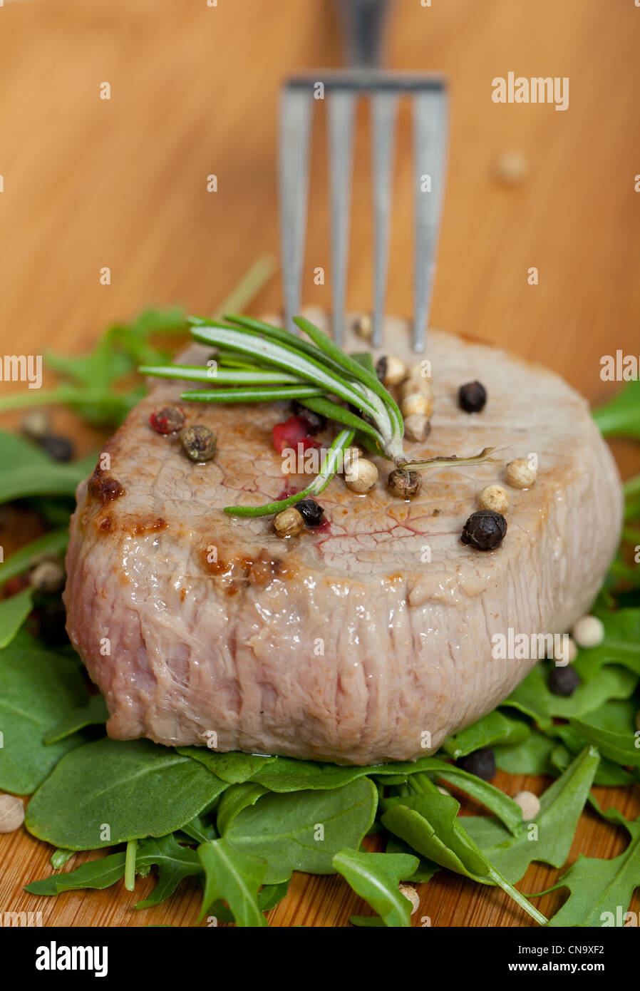 Delicious beef chop on arugula salad Stock Photo - Alamy