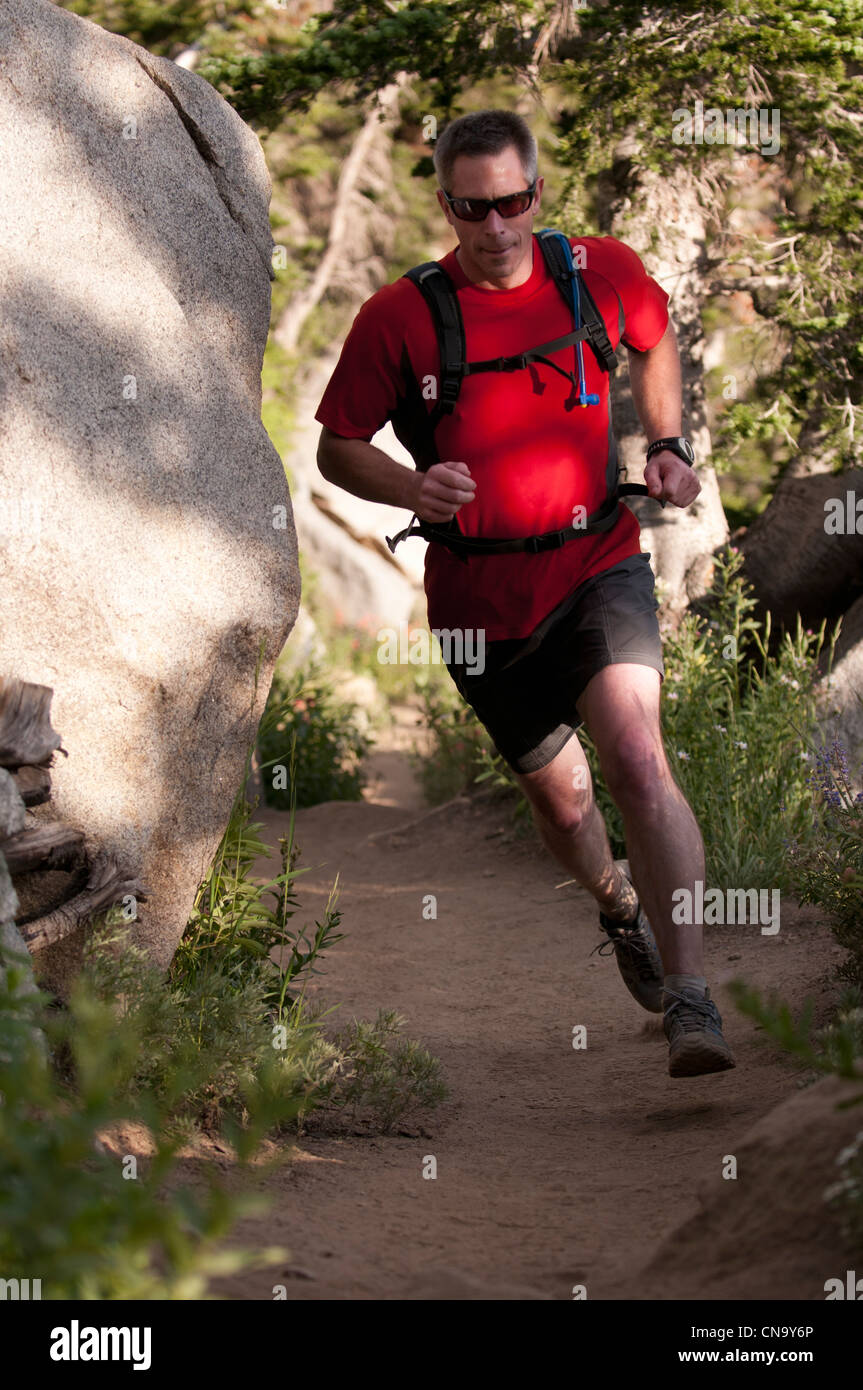 Man running on dirt path Stock Photo - Alamy