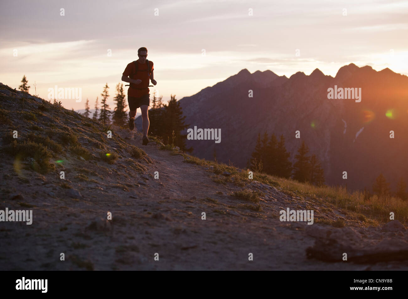 Man running on dirt path Stock Photo - Alamy
