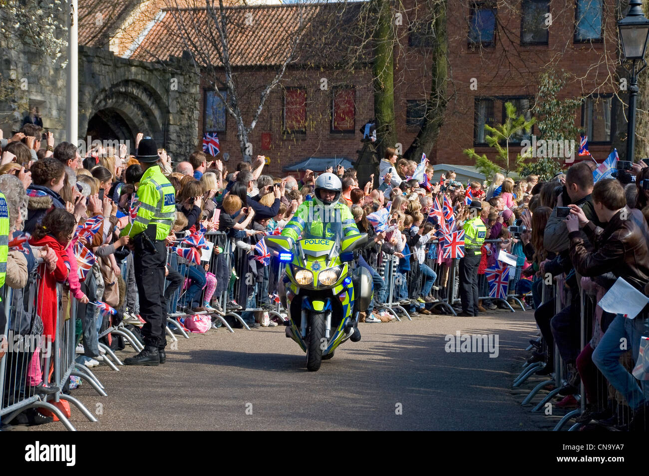 Police motorcycle rider outrider officer escorting the Queen's car ...