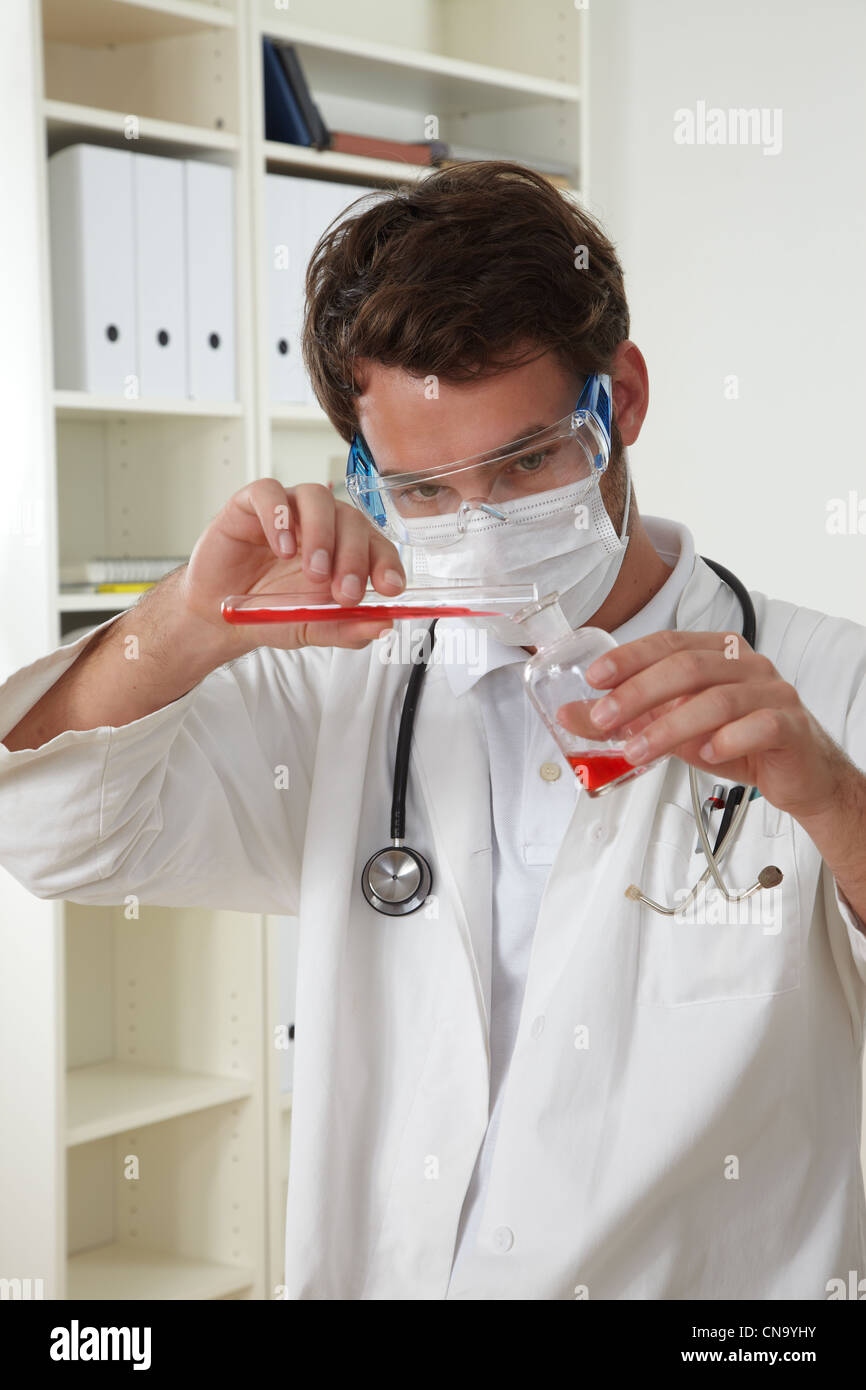 Doctor with chemical analysis Stock Photo - Alamy