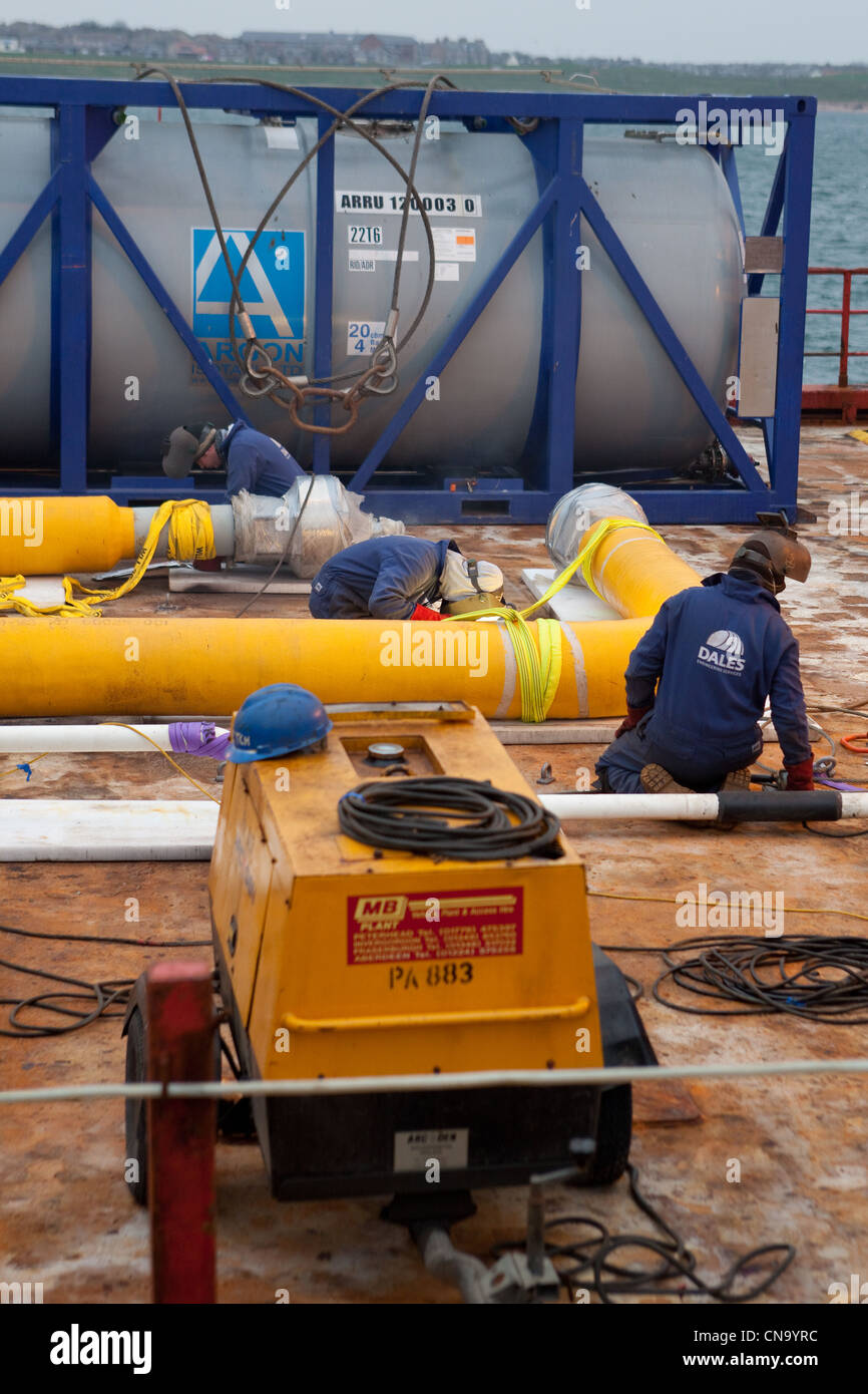 Welders on board Oil supply vessel welding pipelines. Peterhead.UK ...