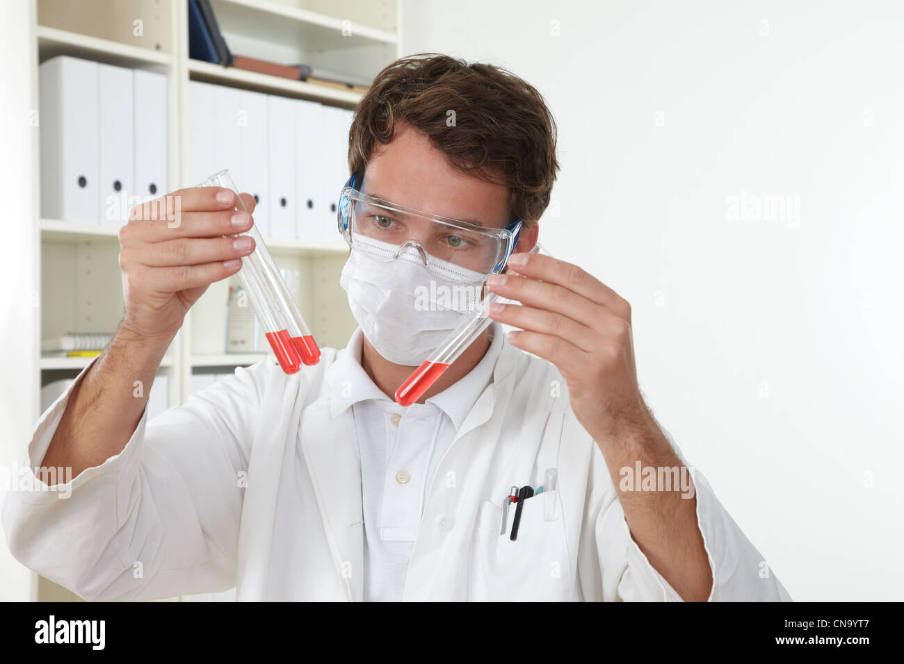Doctor with chemical analysis Stock Photo - Alamy