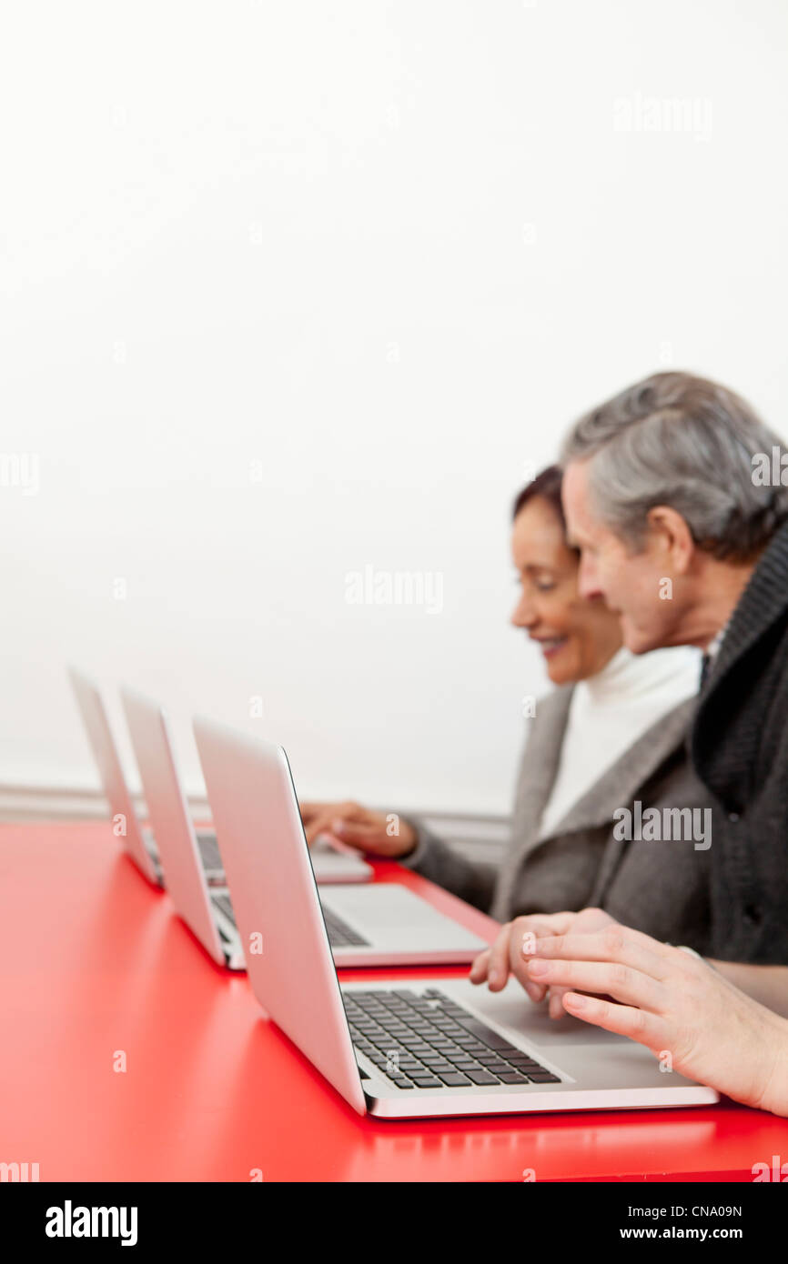 Business people working on laptops Stock Photo - Alamy