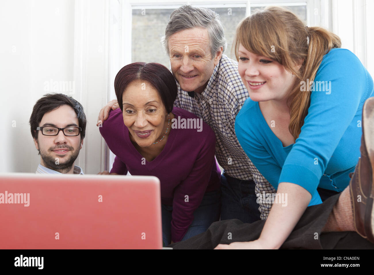 Young men senior sharing laptop hi-res stock photography and images - Alamy