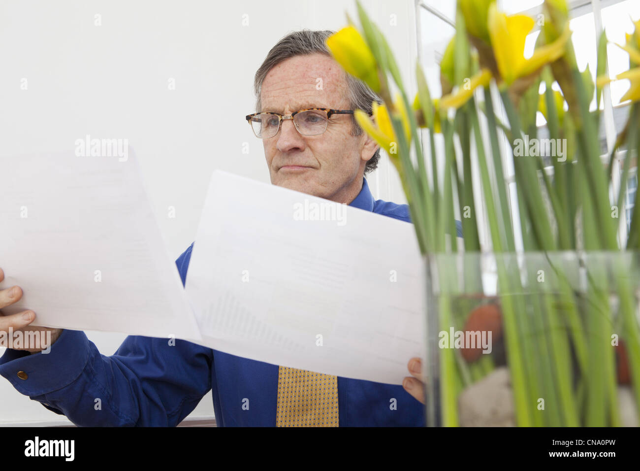 Retired reading papers hi-res stock photography and images - Alamy