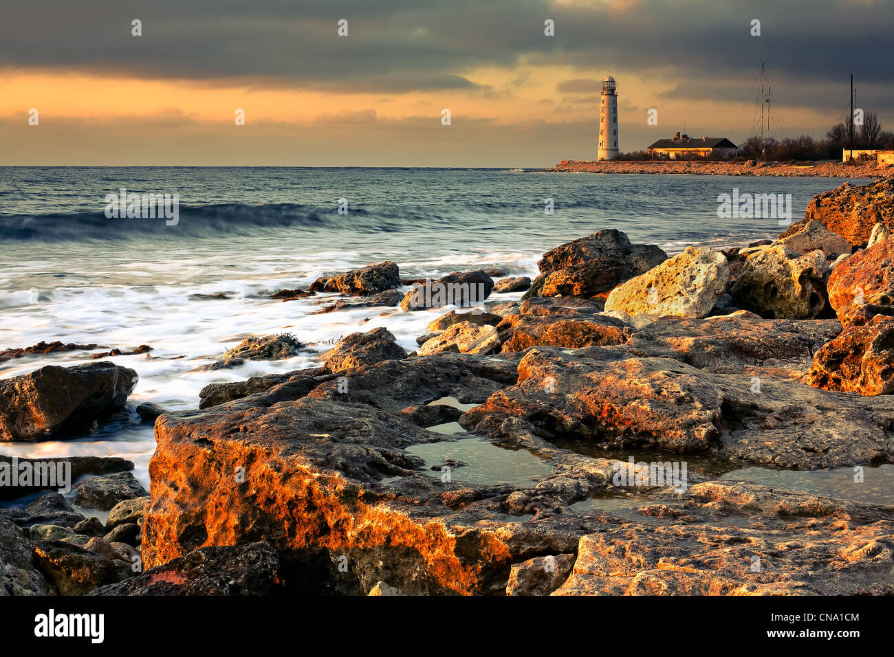 Lighthouse on the shore Stock Photo - Alamy