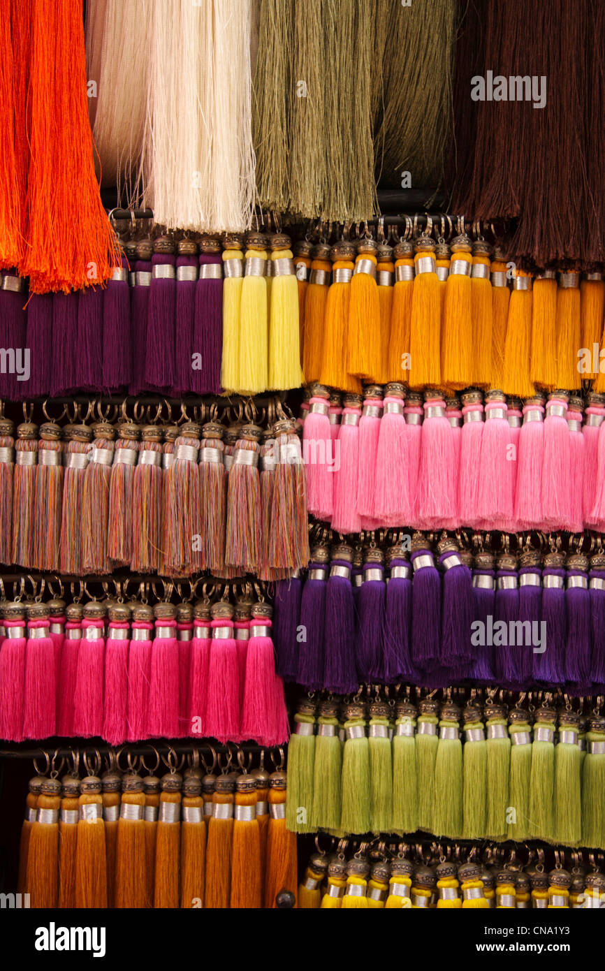 Silk threads/tassels hang for sale in a haberdashery souq, Marrakech ...
