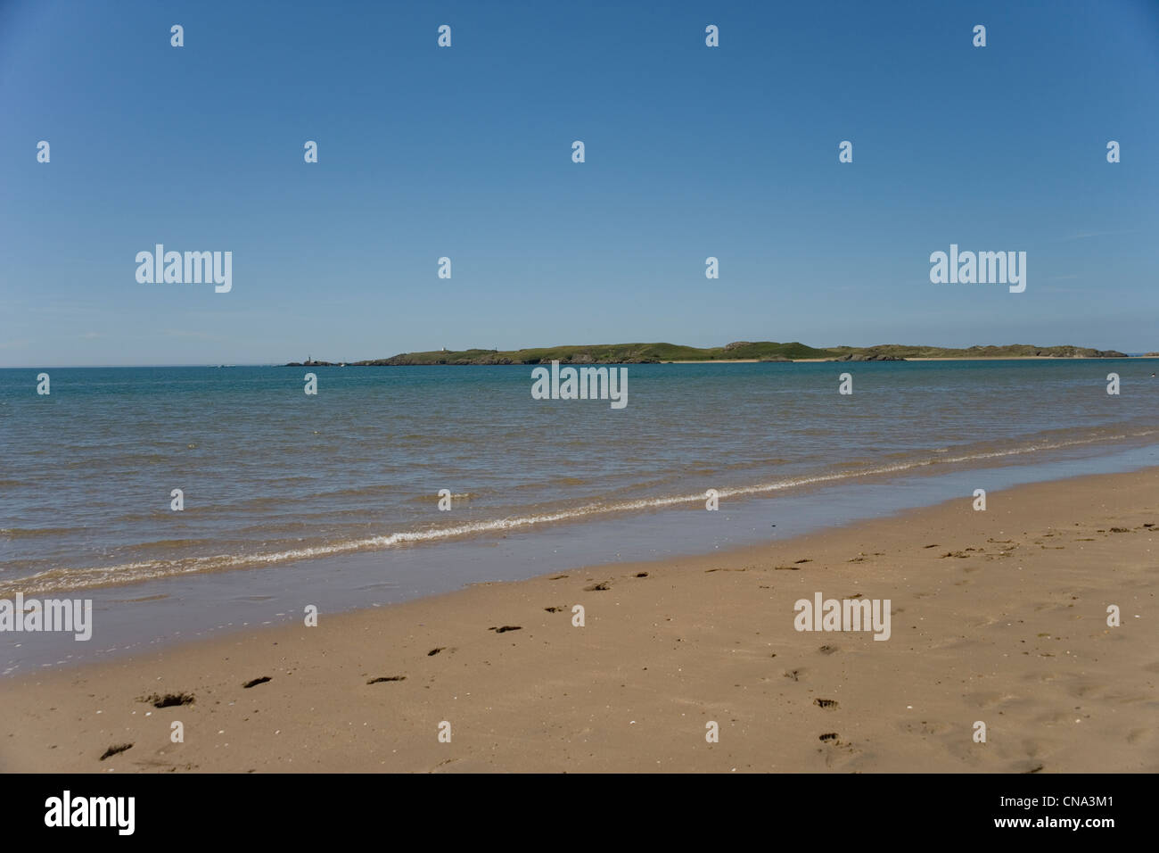 The beach at Traeth Llanddwyn and Llanddwyn island on Anglesey Stock ...
