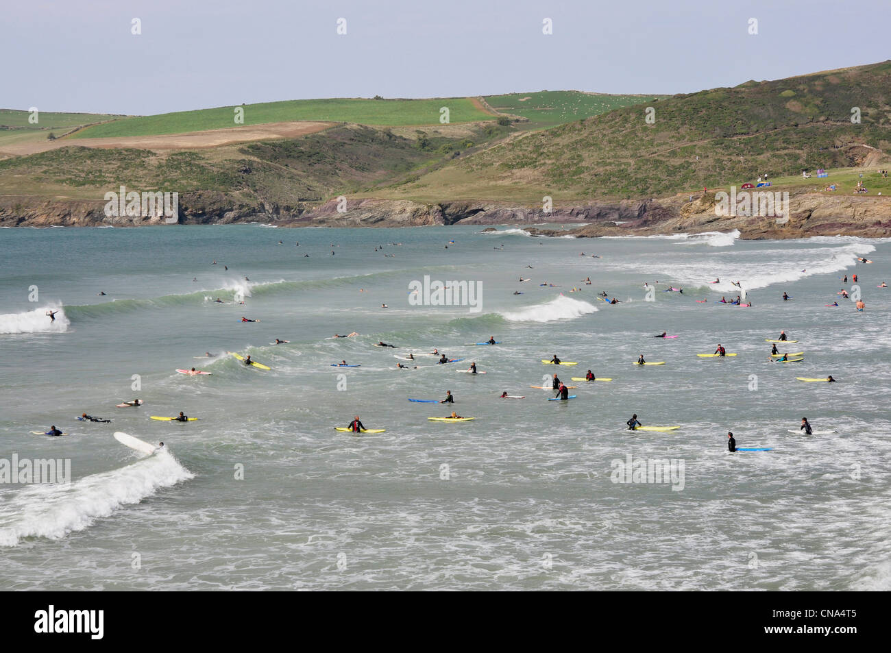 Cornwall - Hayle Bay - surfers catching the breakers - backdrop ...