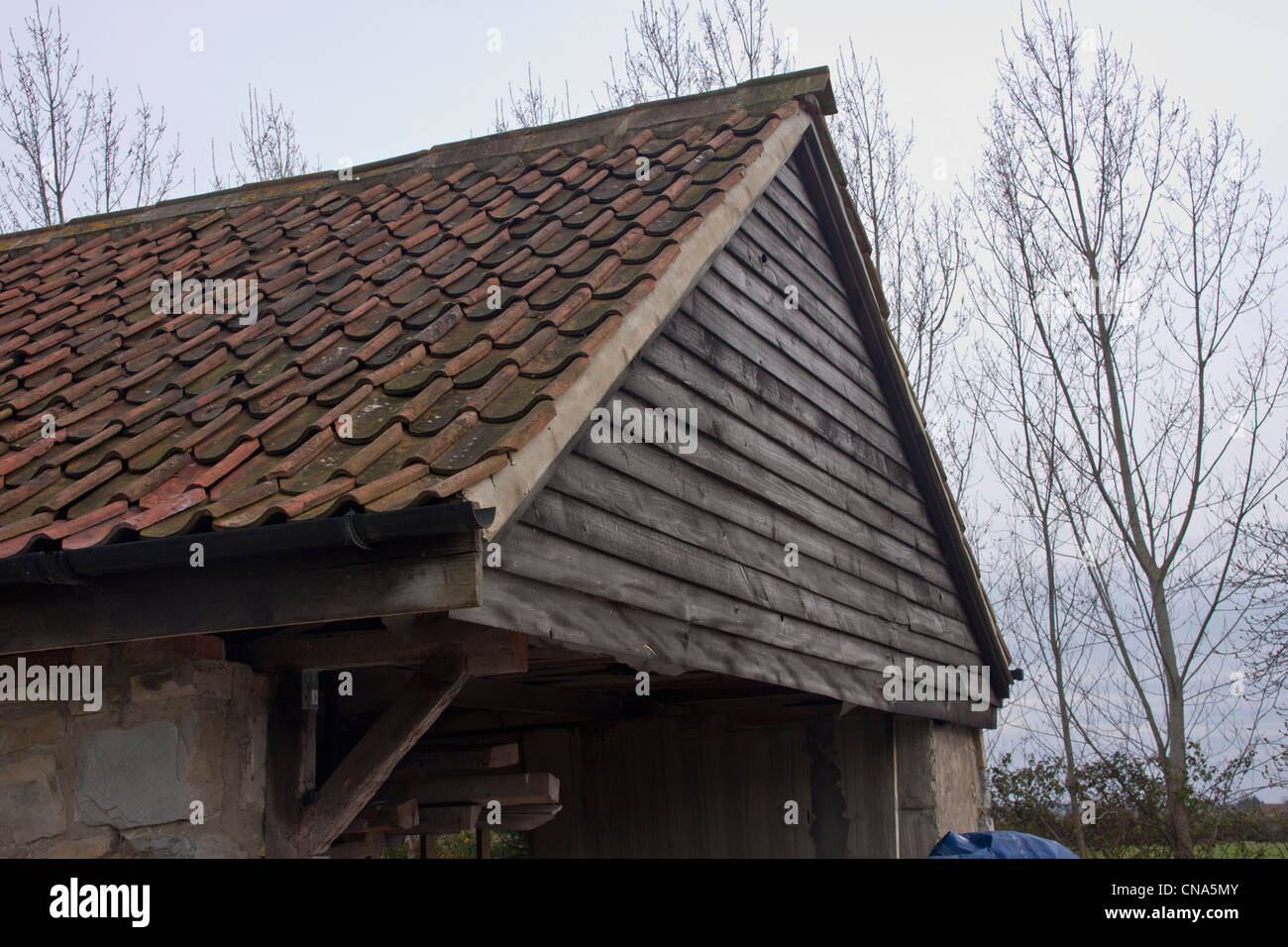 re-built old stone wood barn on farm in somerset Stock Photo - Alamy