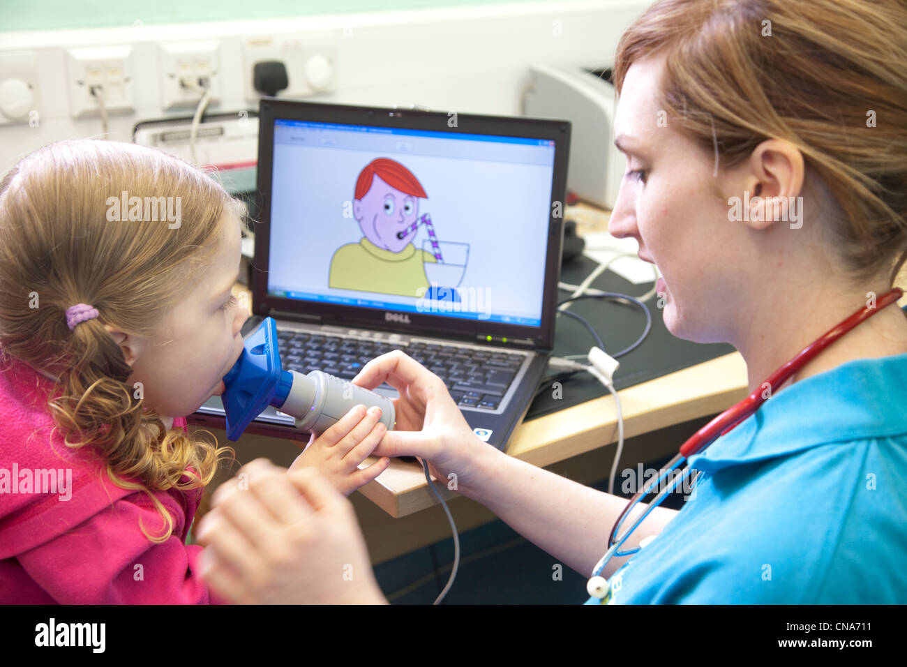 A young girl undergoes a spirometry lung function test UK Stock Photo ...