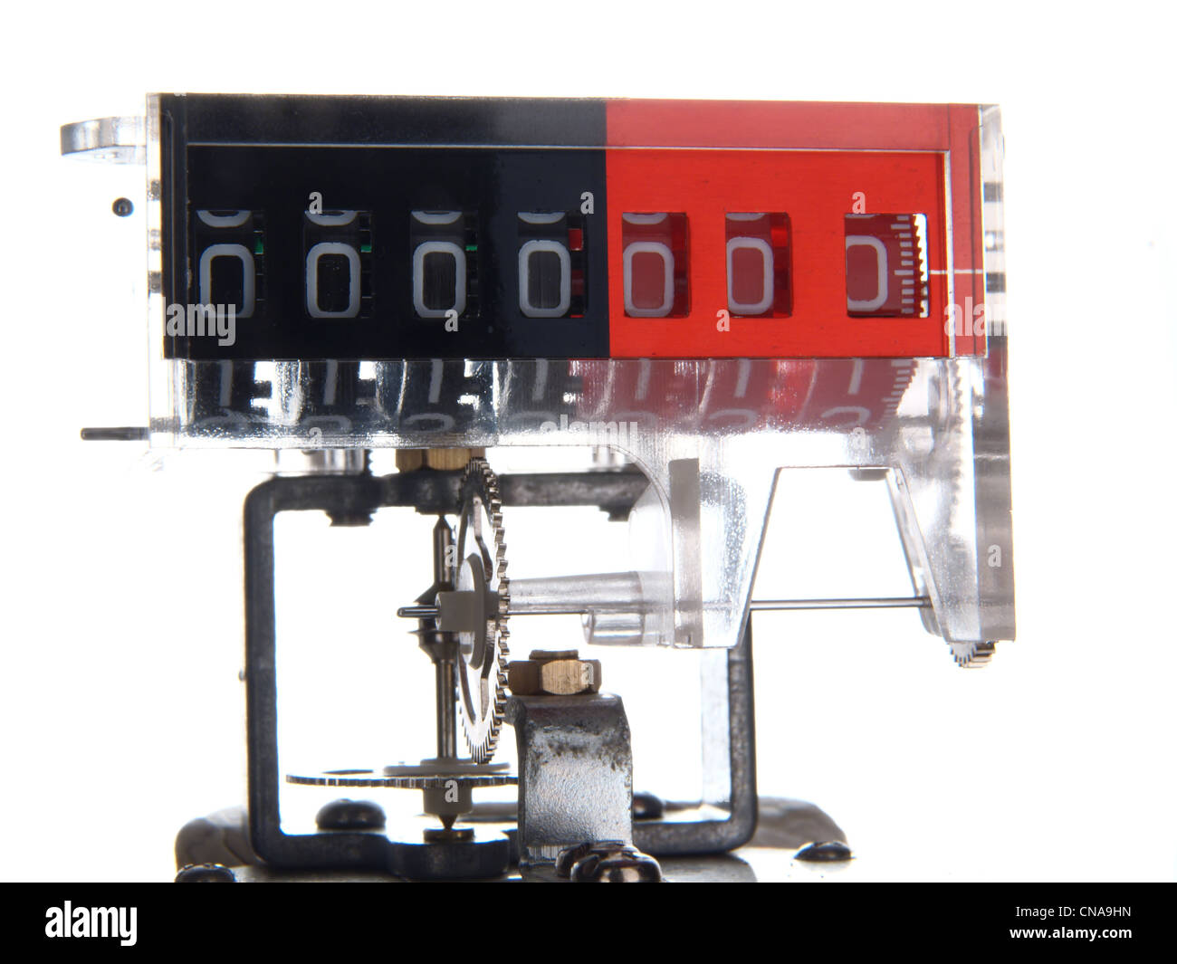 The mechanism of a mechanical counter with gears, isolated on a white ...