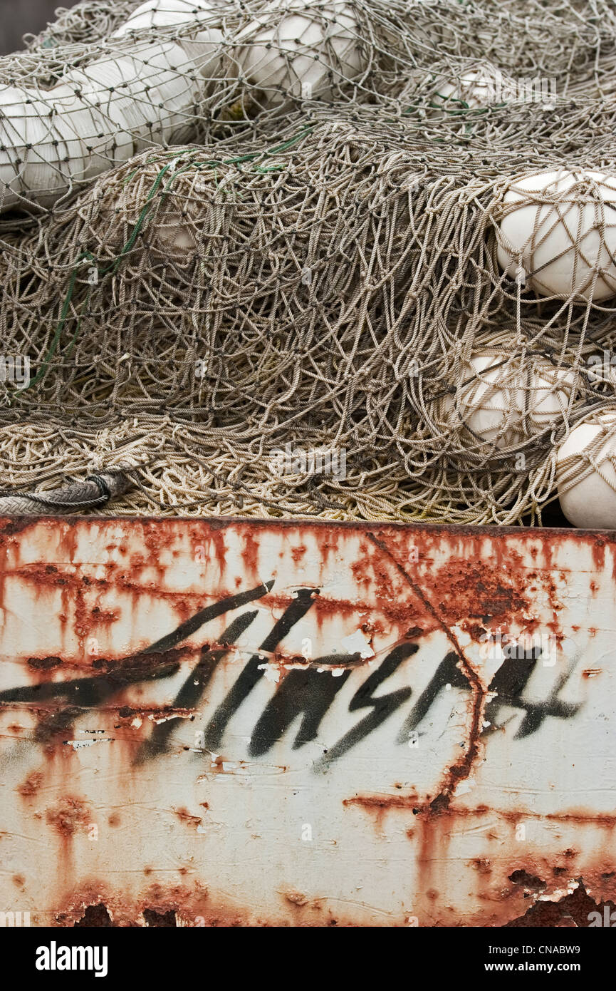 Commercial fishing nets with white floats stacked on old Alaska Airline ...